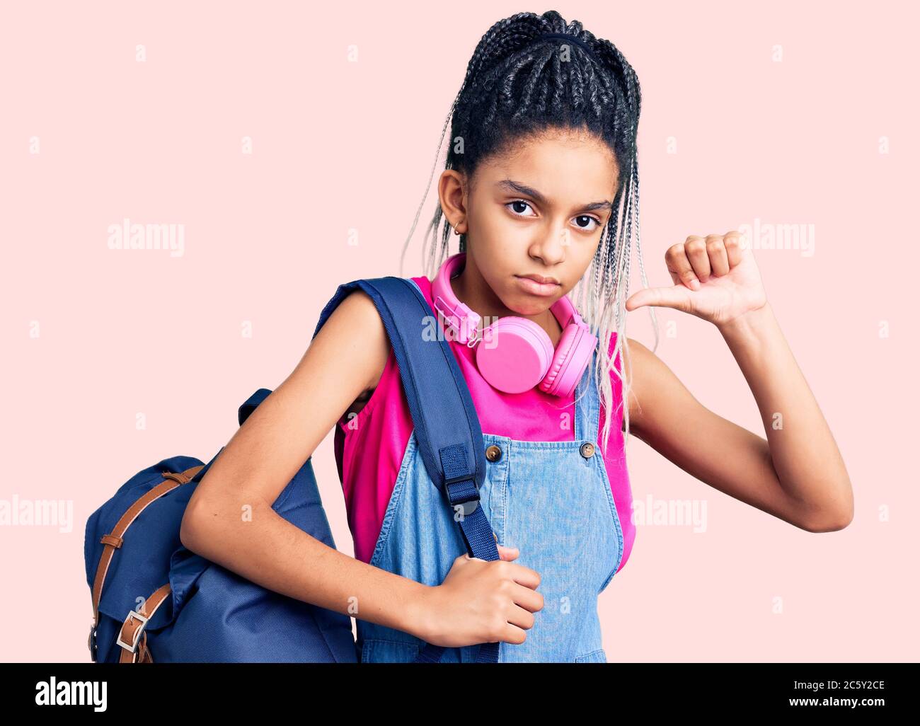 Cute african american girl holding student backpack using backpack with ...