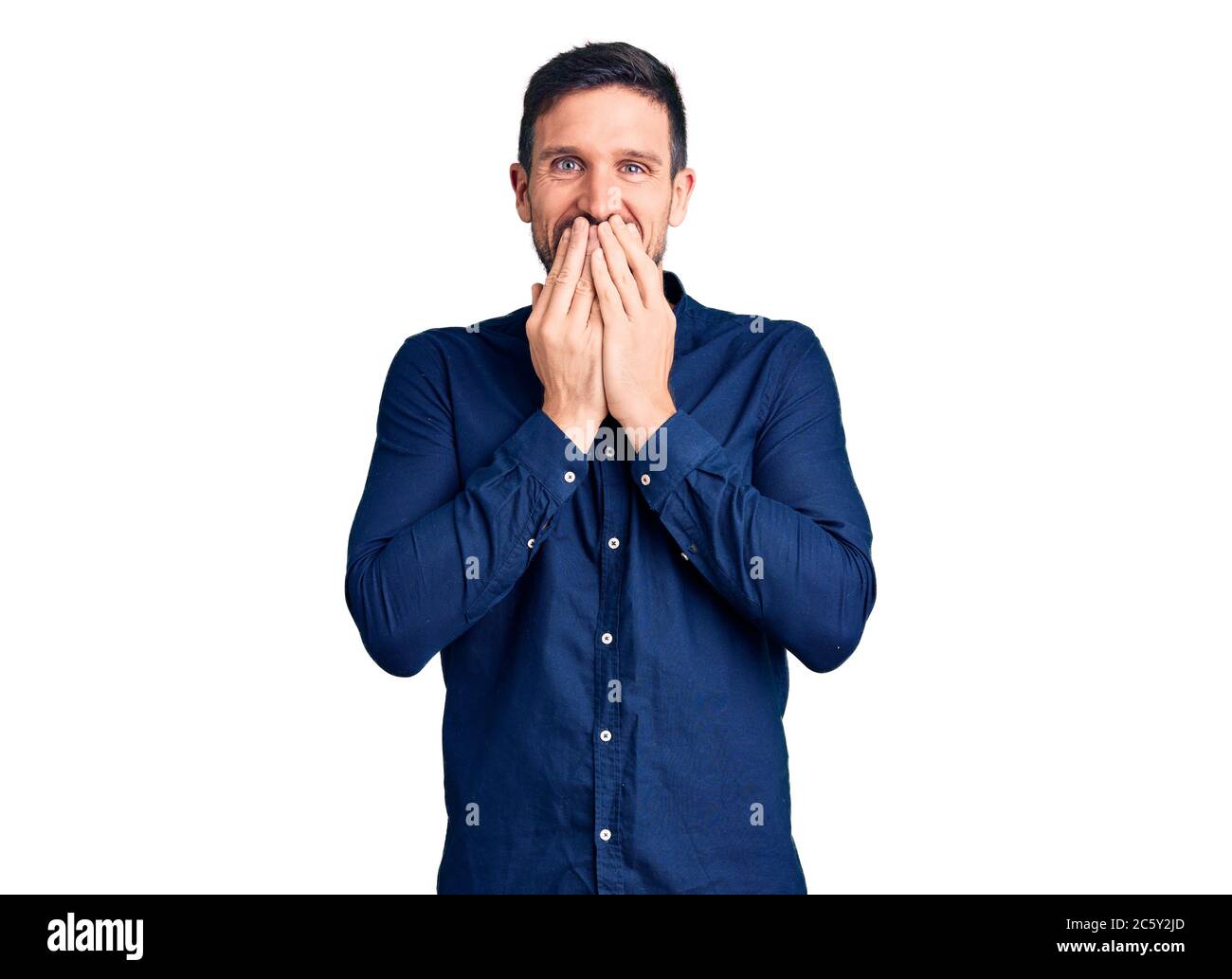 Young handsome man wearing casual shirt laughing and embarrassed giggle ...