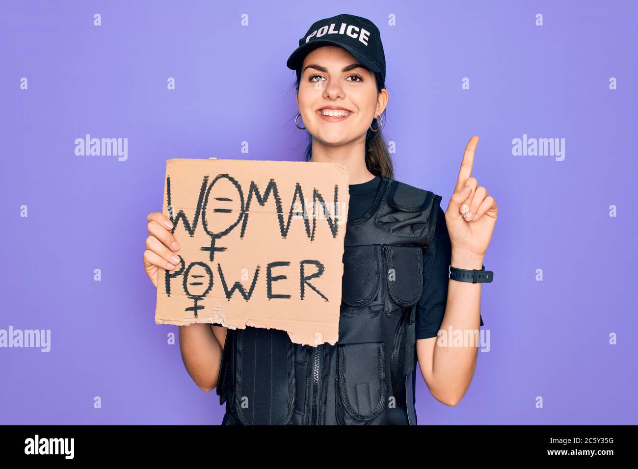 Police woman wearing security bulletproof vest uniform holding woman ...