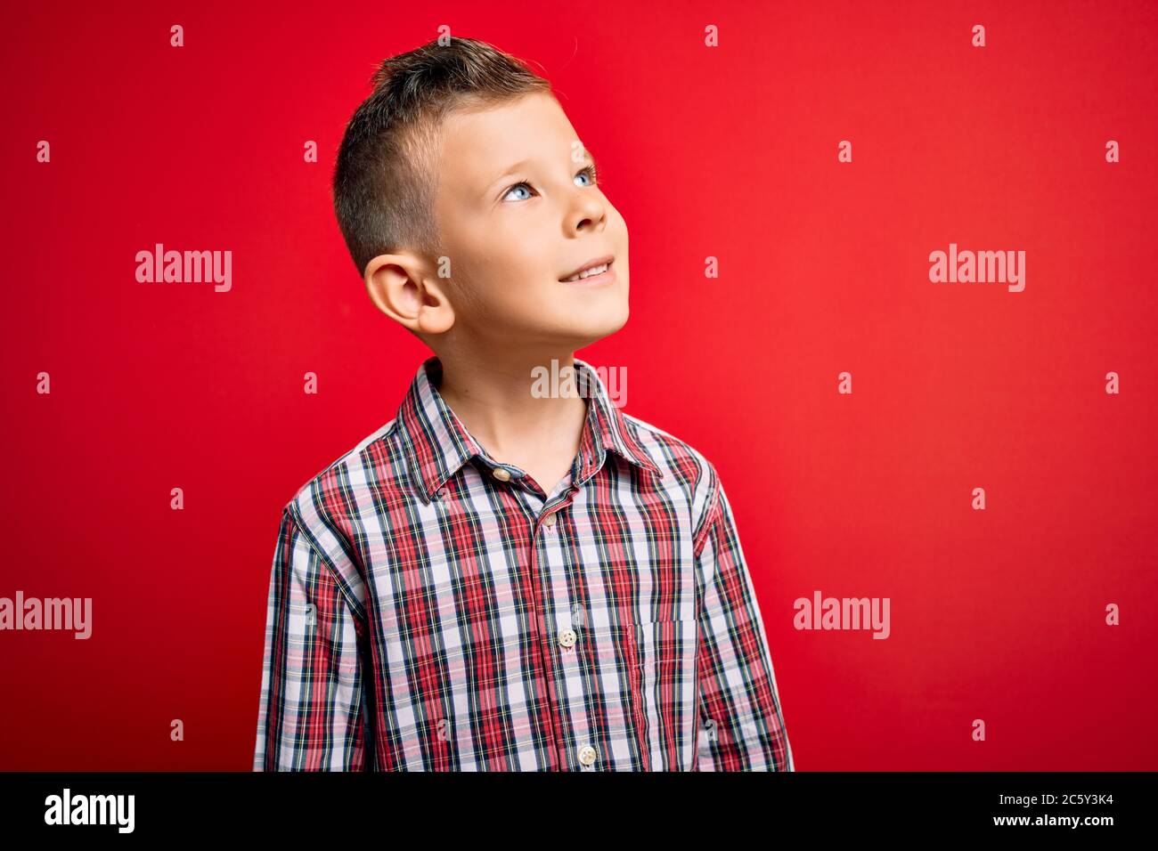 Young little caucasian kid with blue eyes standing wearing elegant ...