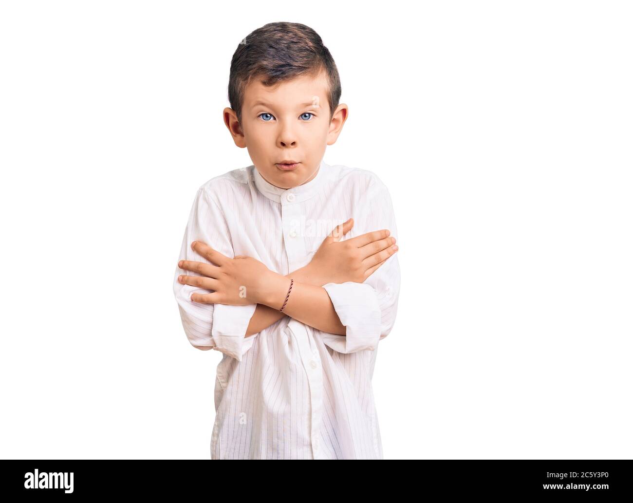 Cute blond kid wearing elegant shirt shaking and freezing for winter ...