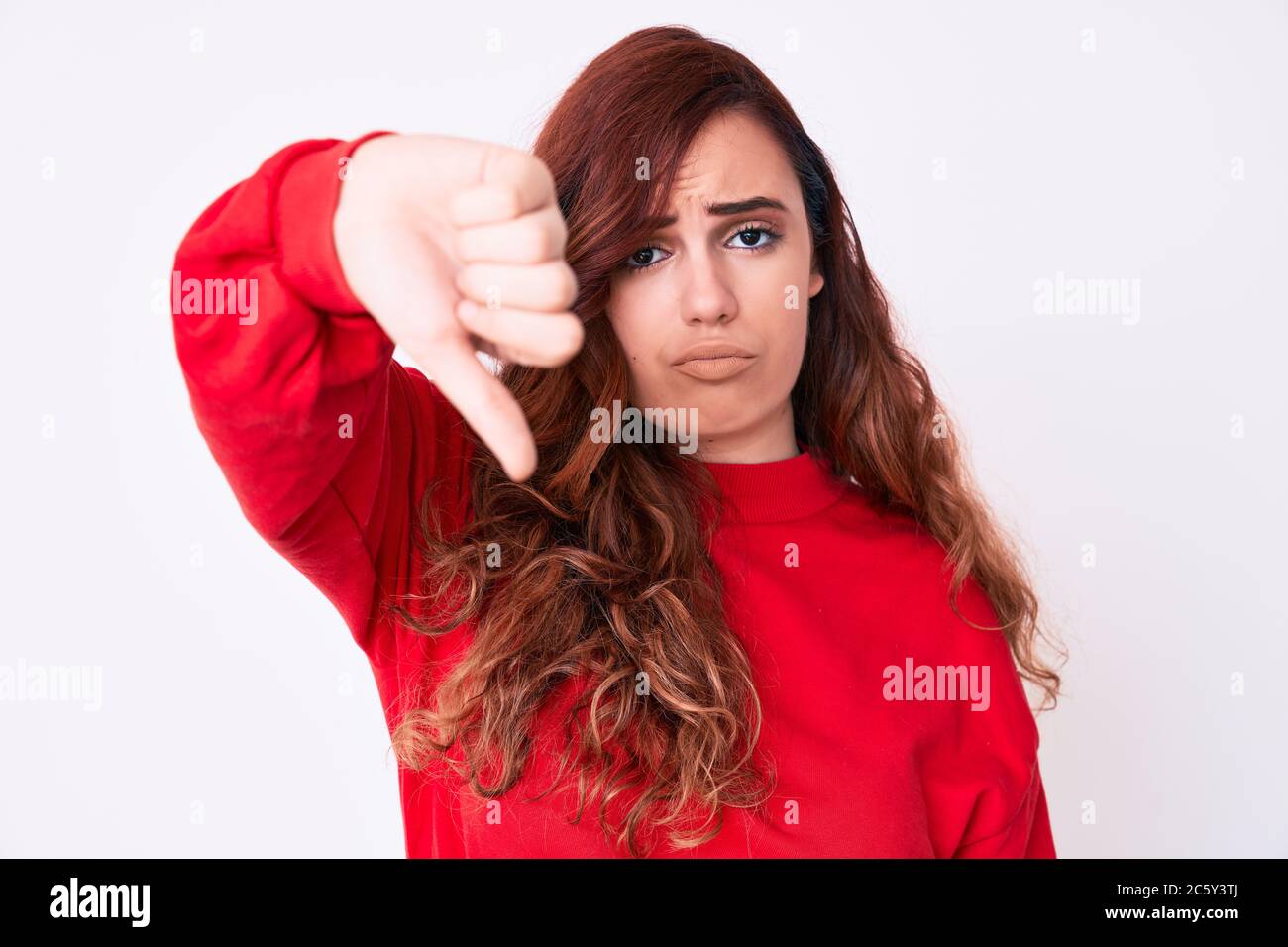 Young beautiful woman wearing casual clothes looking unhappy and angry ...