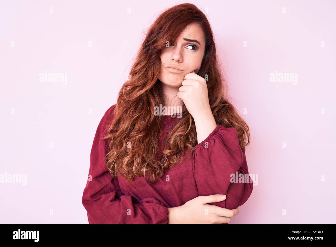 Young beautiful woman wearing casual winter sweater serious face ...