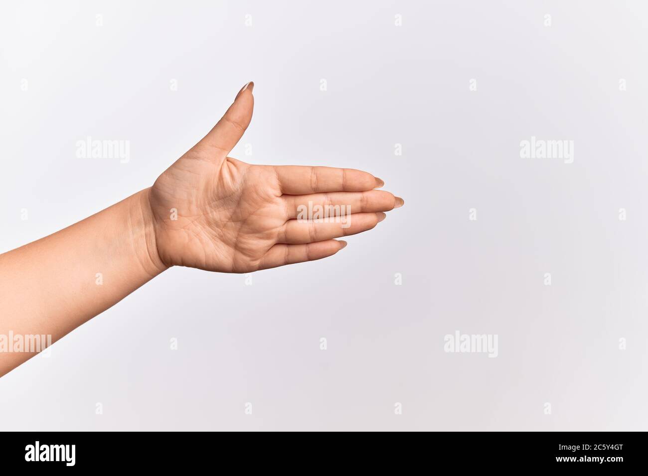 Hand of caucasian young woman stretching and reaching with open hand ...