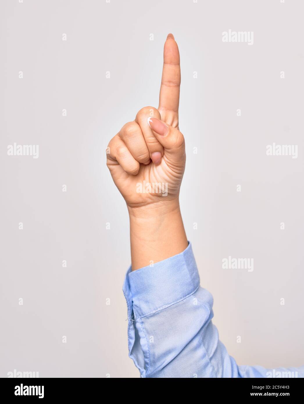 Hand of caucasian young woman doing fist symbol showing number one with ...