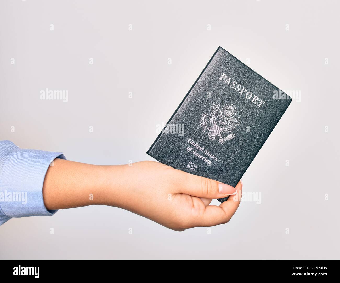 Hand of caucasian young woman holding united states passport document ...