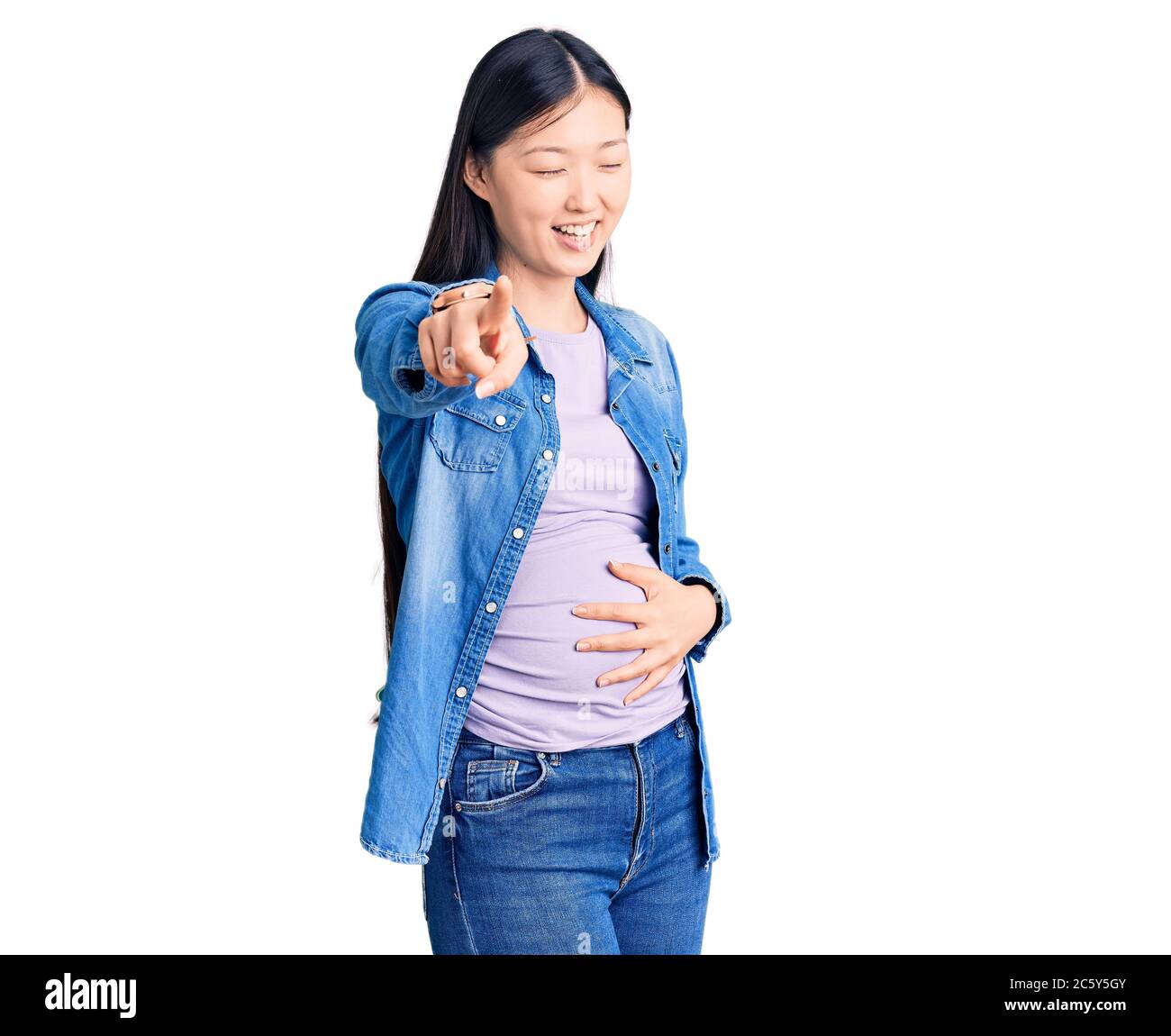 Young beautiful chinese woman pregnant expecting baby laughing at you ...