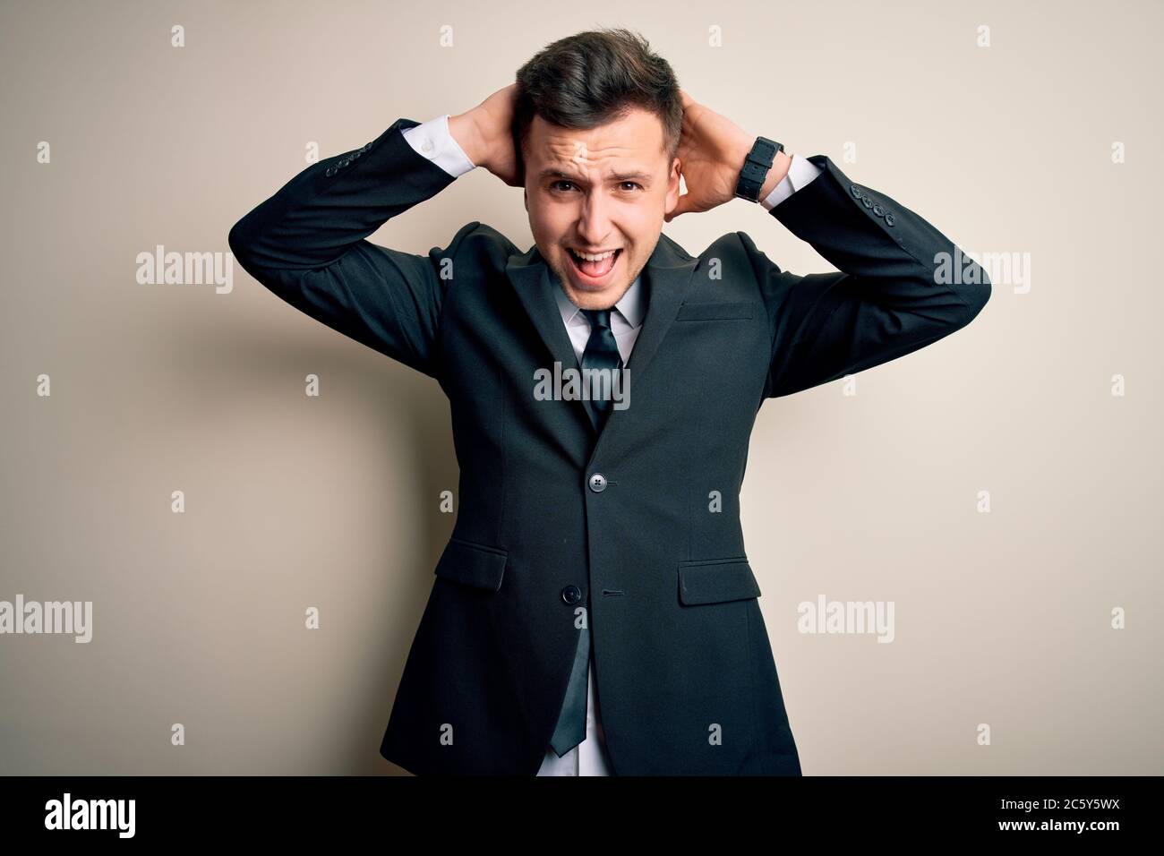 Young handsome business man wearing elegant suit and tie over isolated ...