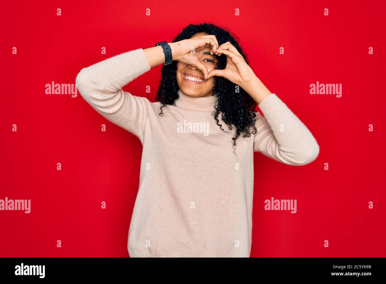 Young african american curly woman wearing casual turtleneck sweater ...