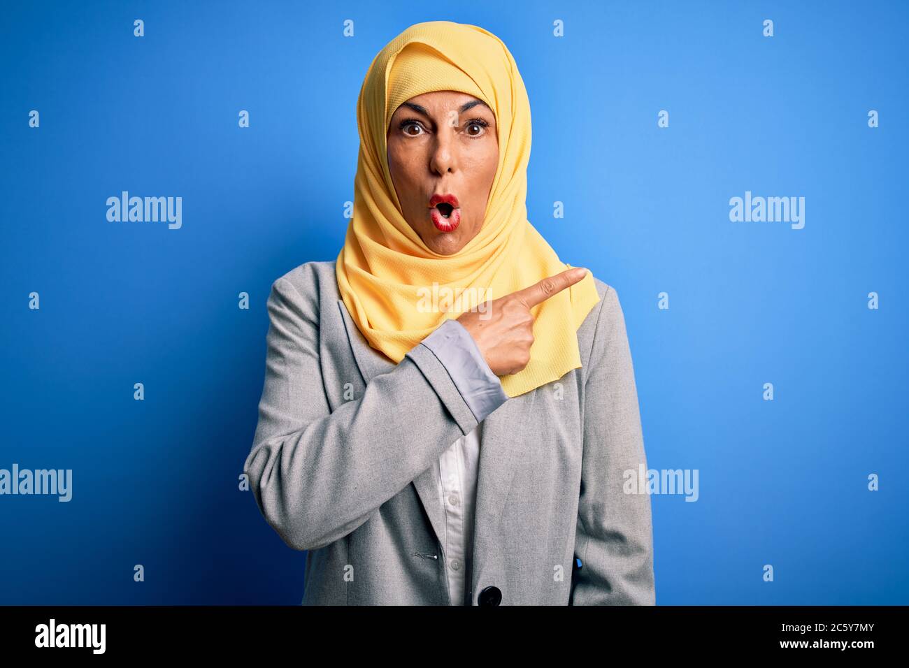 Middle age brunette business woman wearing muslim traditional hijab ...