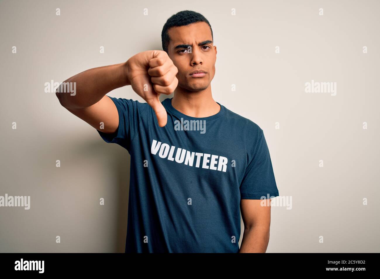 Young handsome african american man volunteering wearing t-shirt with ...