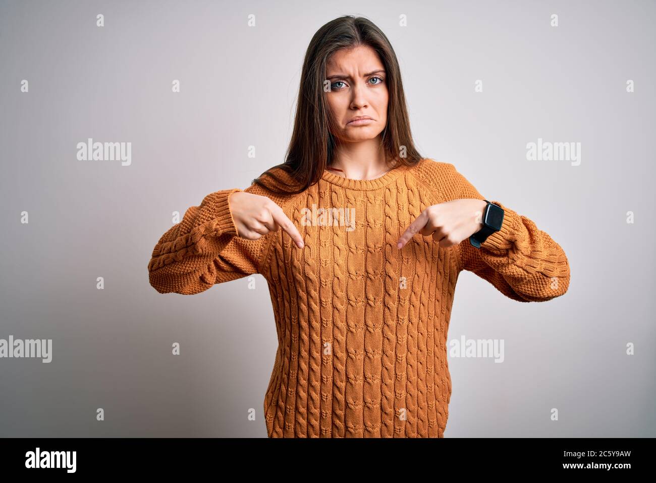 Young beautiful woman with blue eyes wearing casual sweater standing ...