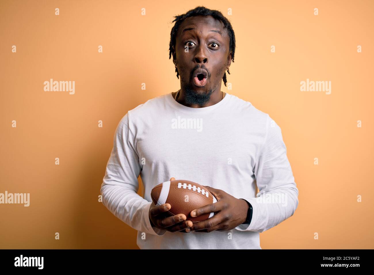 Young african player man playing rugby holding american football ball ...