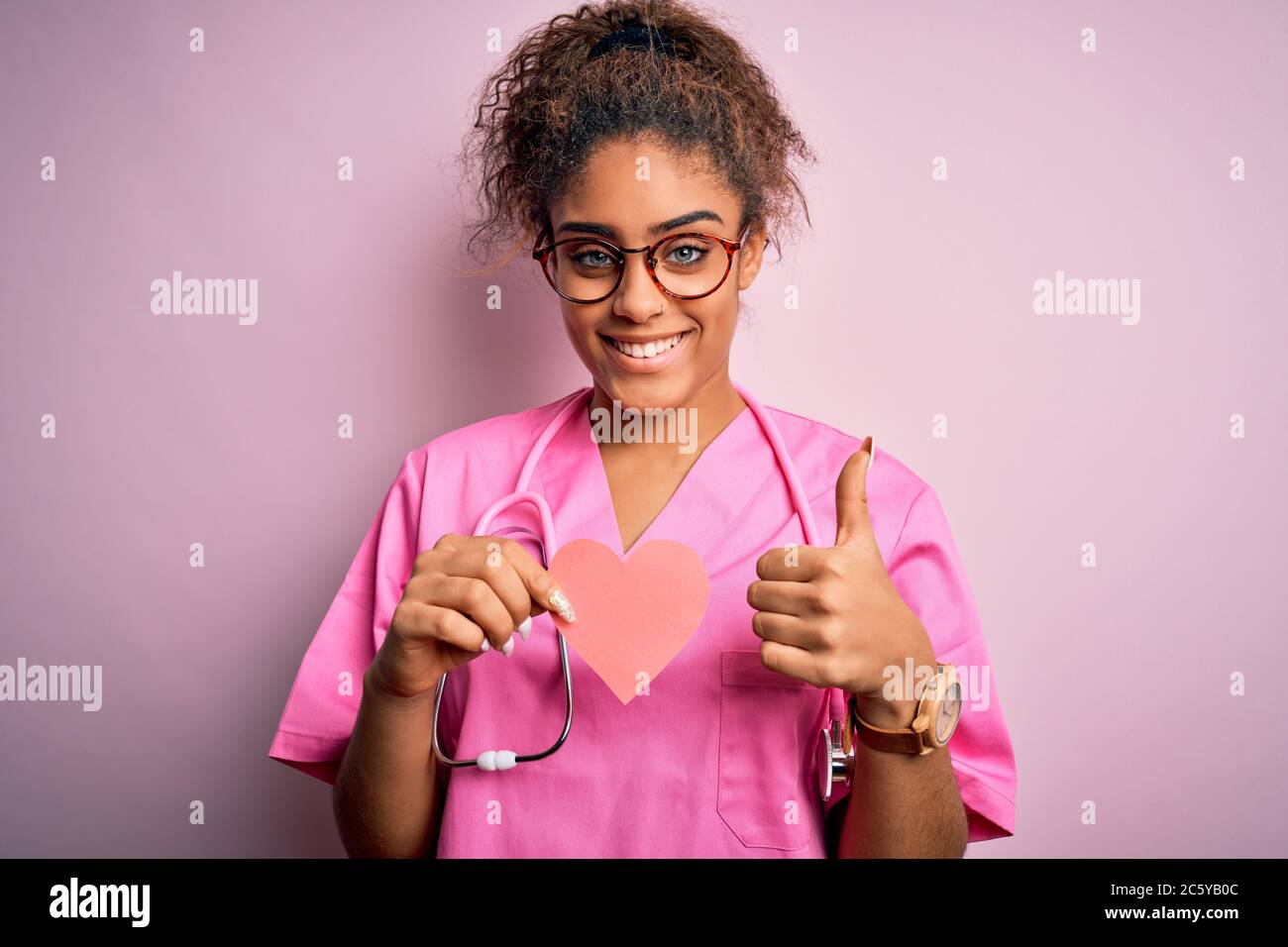 African american cardiologist girl wearing medical uniform and ...