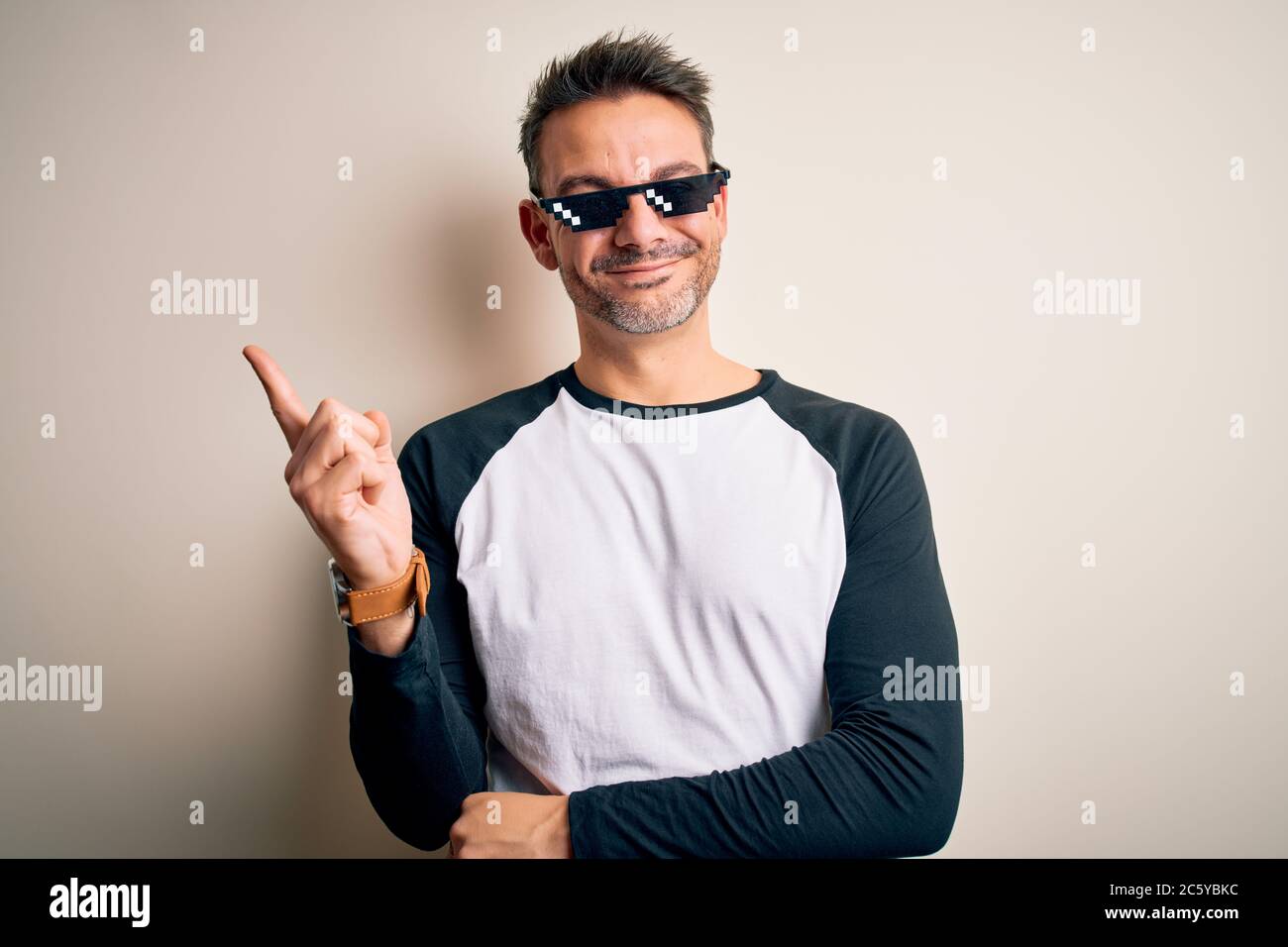 Young handsome man wearing funny thug life sunglasses meme over white ...