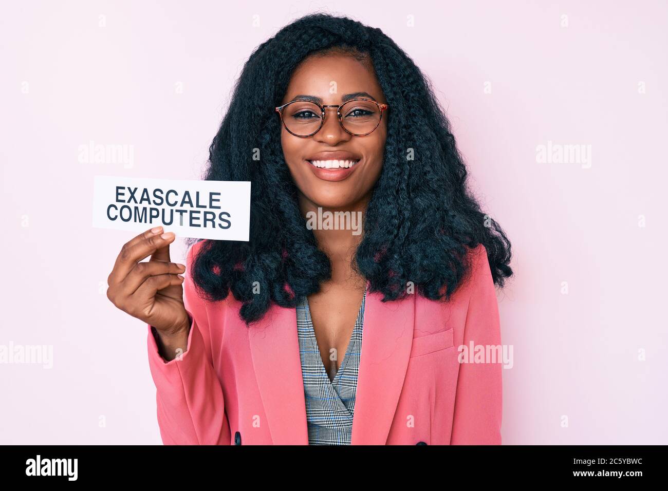 Beautiful african woman holding exascale computers banner looking ...