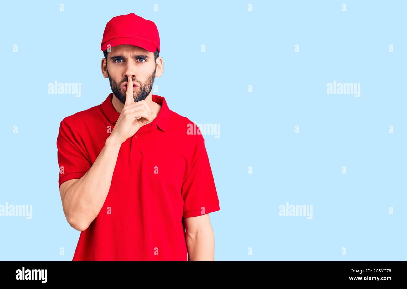 Young Handsome Man With Beard Wearing Delivery Uniform Asking To Be