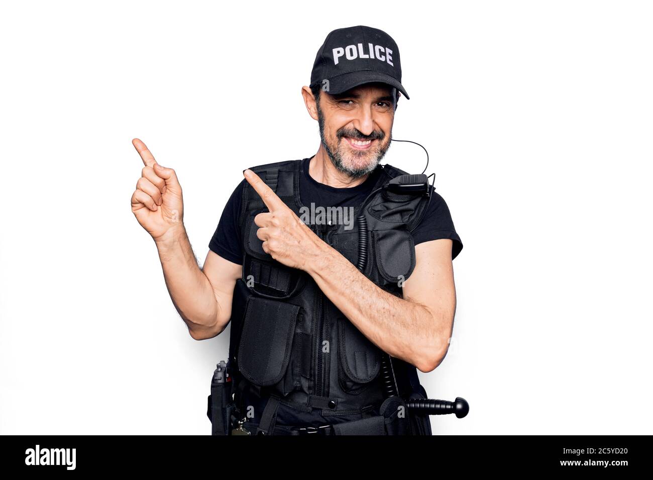Middle age policeman wearing police uniform and bulletproof vest over ...