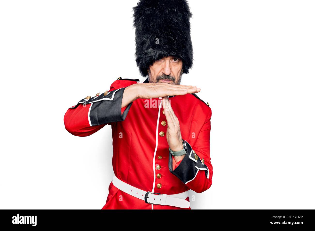 Middle age handsome wales guard man wearing traditional uniform over ...