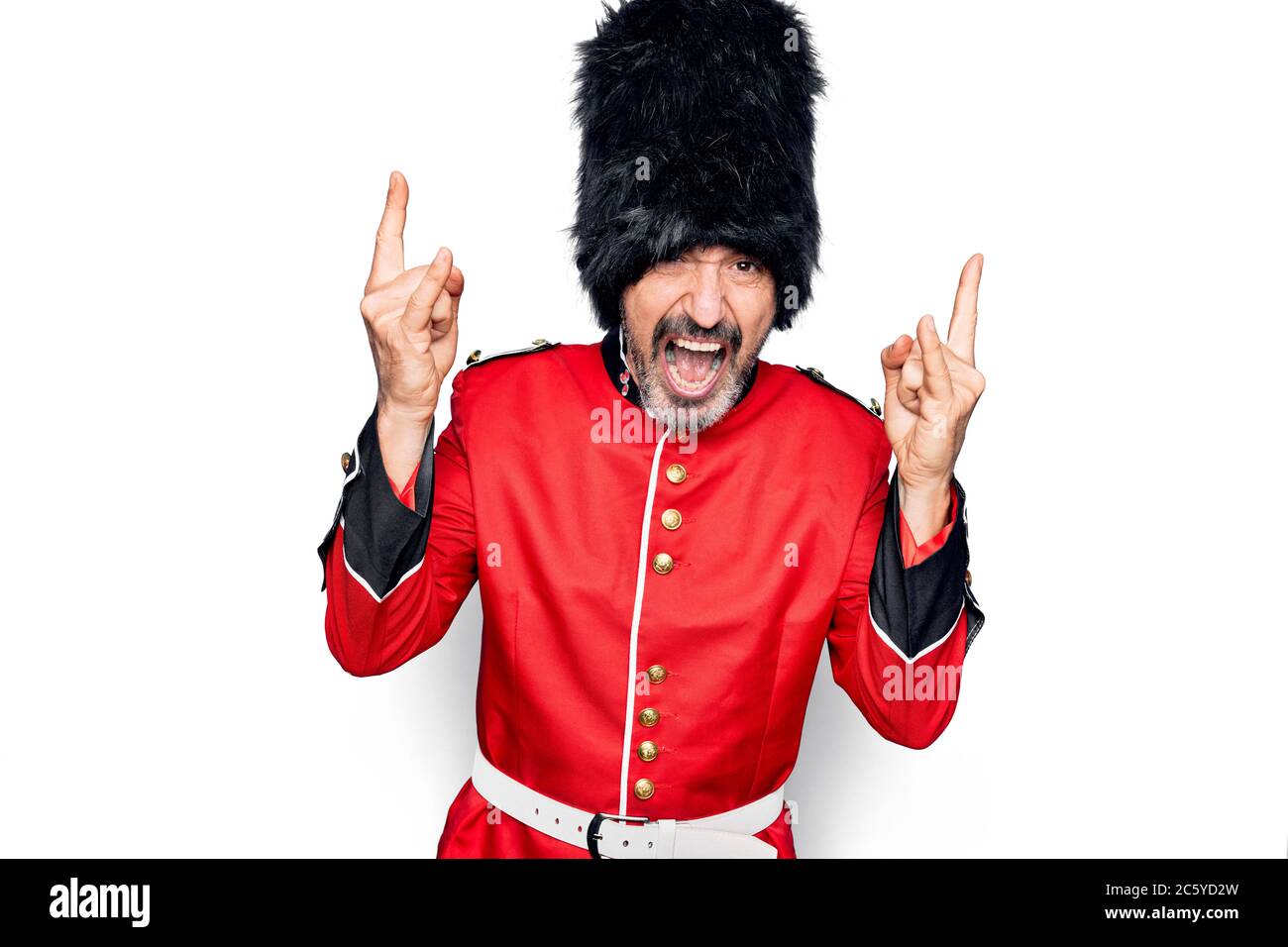 Middle age handsome wales guard man wearing traditional uniform over ...