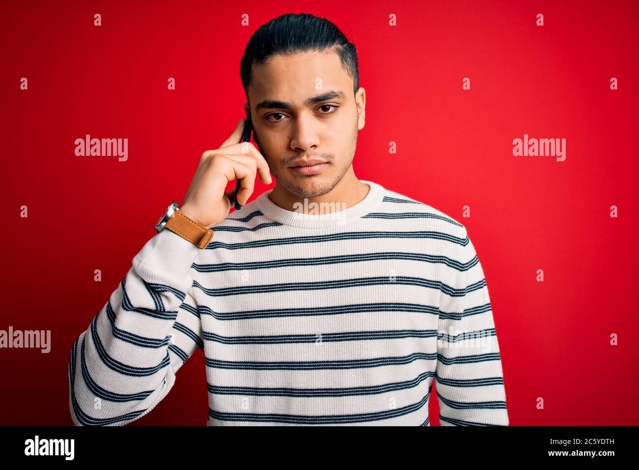 Brazilian man having conversation talking on the smartphone over ...