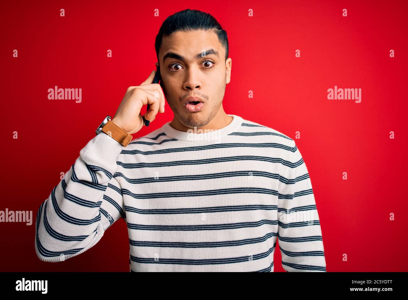 Brazilian man having conversation talking on the smartphone over ...