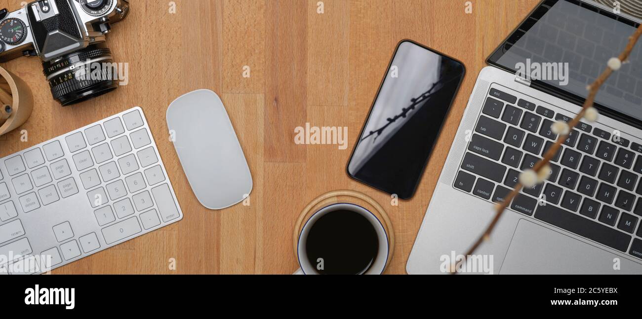 Top view of modern workspace with laptop, wireless computer devices ...