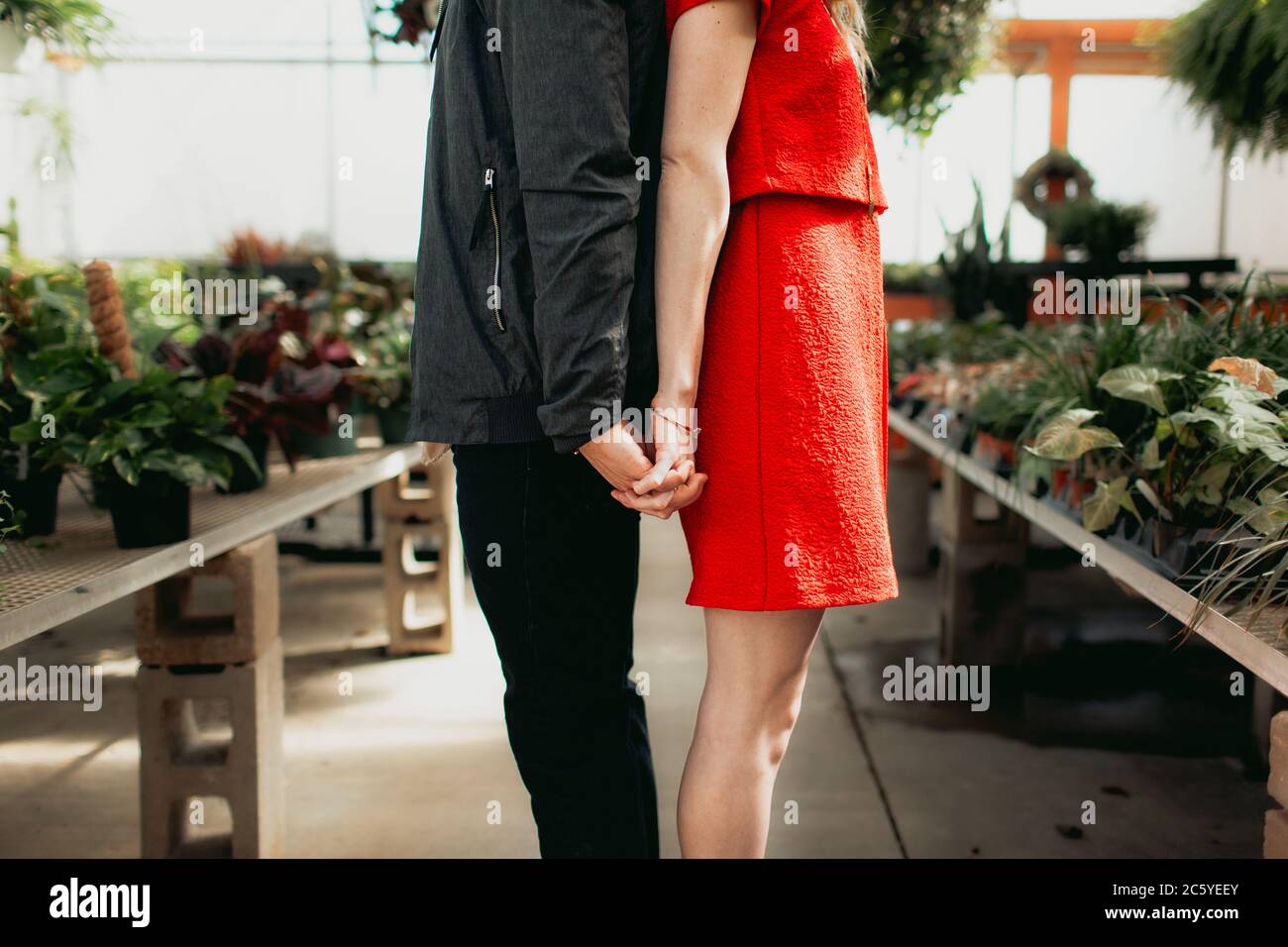 Man woman holding dress hi-res stock photography and images - Alamy
