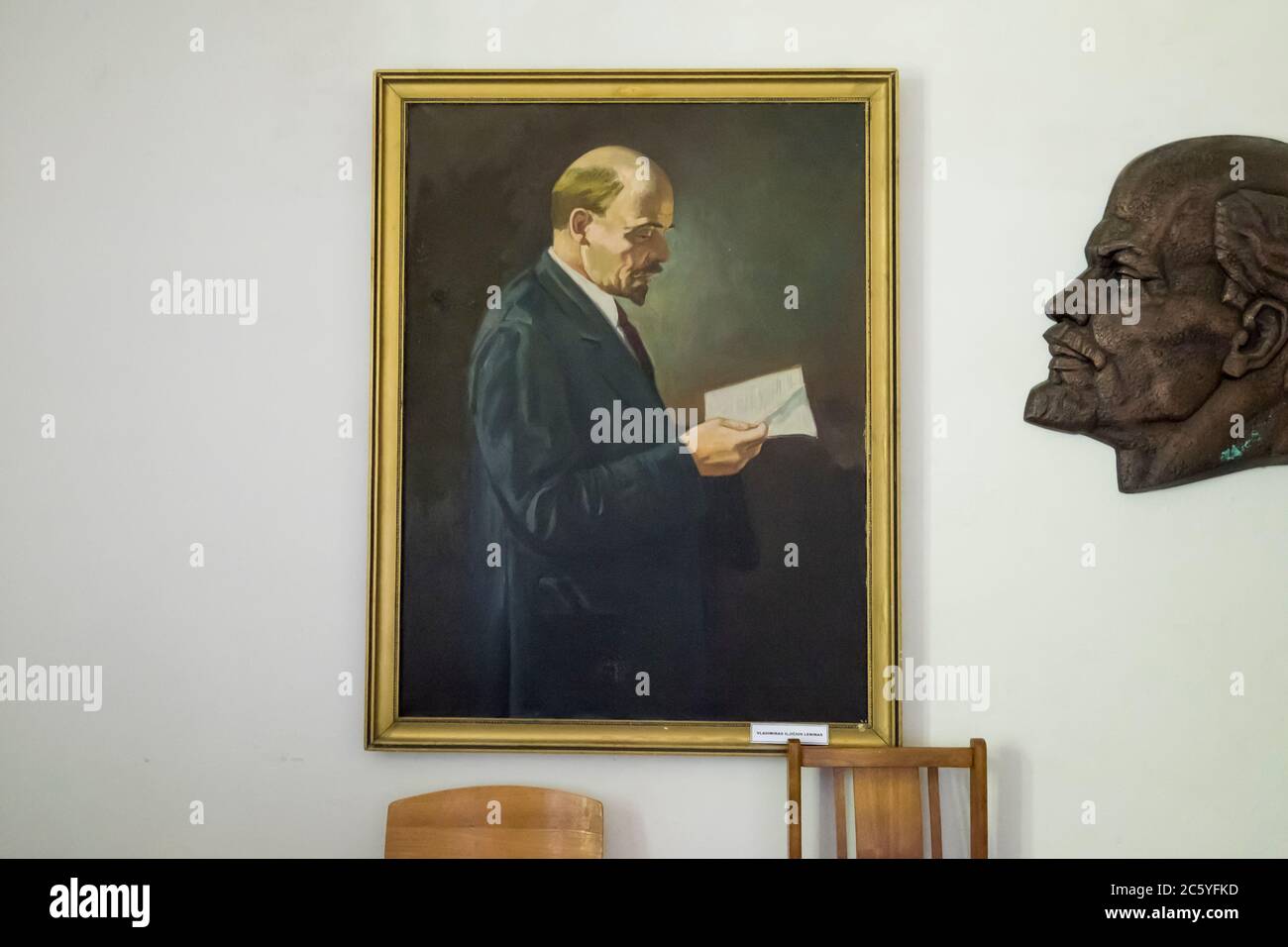 A painting of Lenin reading hangs in the former prison building used by ...