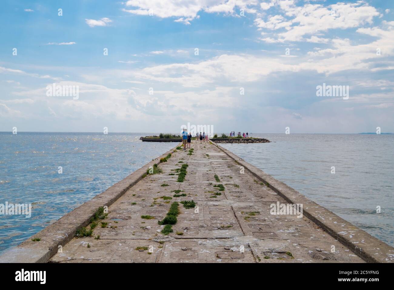 The concrete pier, stretching into the Curonian Spit lagoon at the bird ...