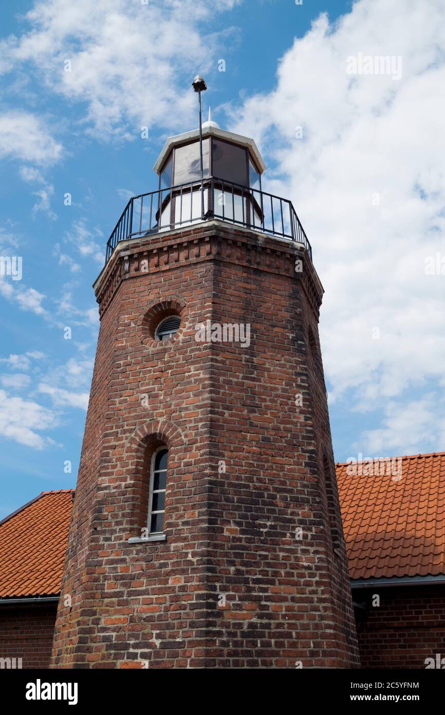 The old, red brick lighthouse at the bird sanctuary. At the Ventes ...