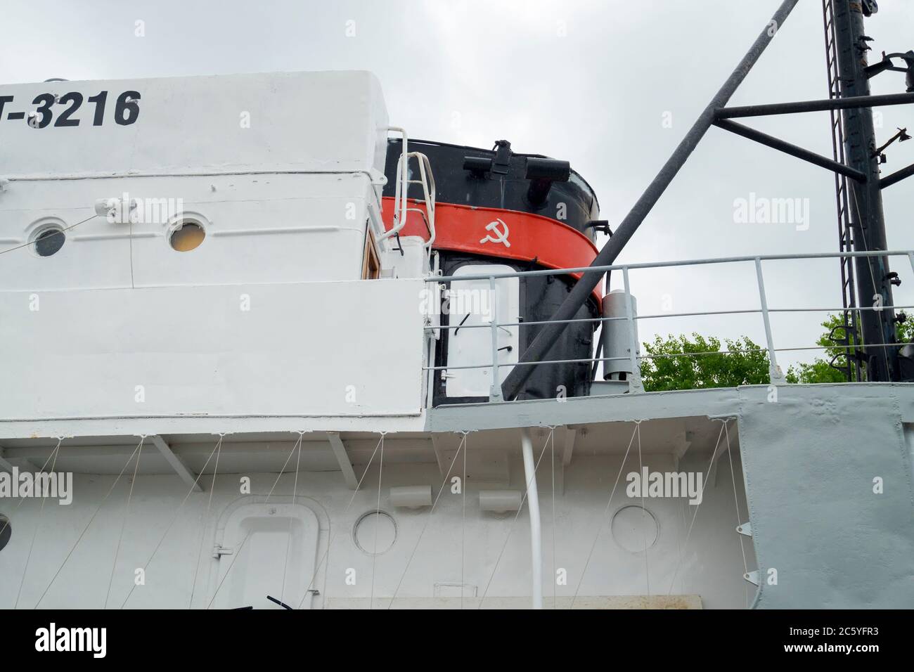 A detail of the hammer and sickle Communist symbol of the steel-hulled ...