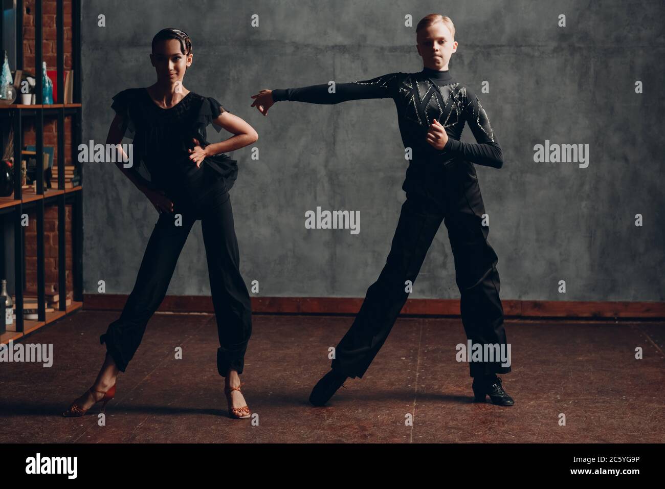 Young couple dancing in ballroom dance cha cha Stock Photo - Alamy