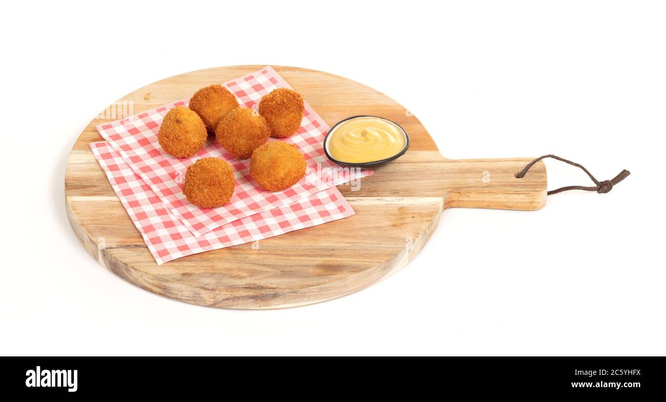 Dutch traditional snack bitterbal on a serving board, isolated Stock ...