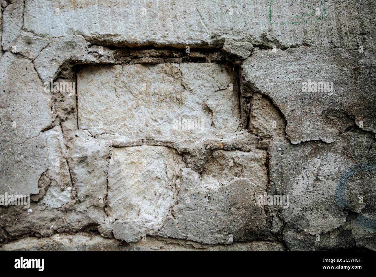 An old wall that is collapsing. Bricks visible. Textured. Destruction ...