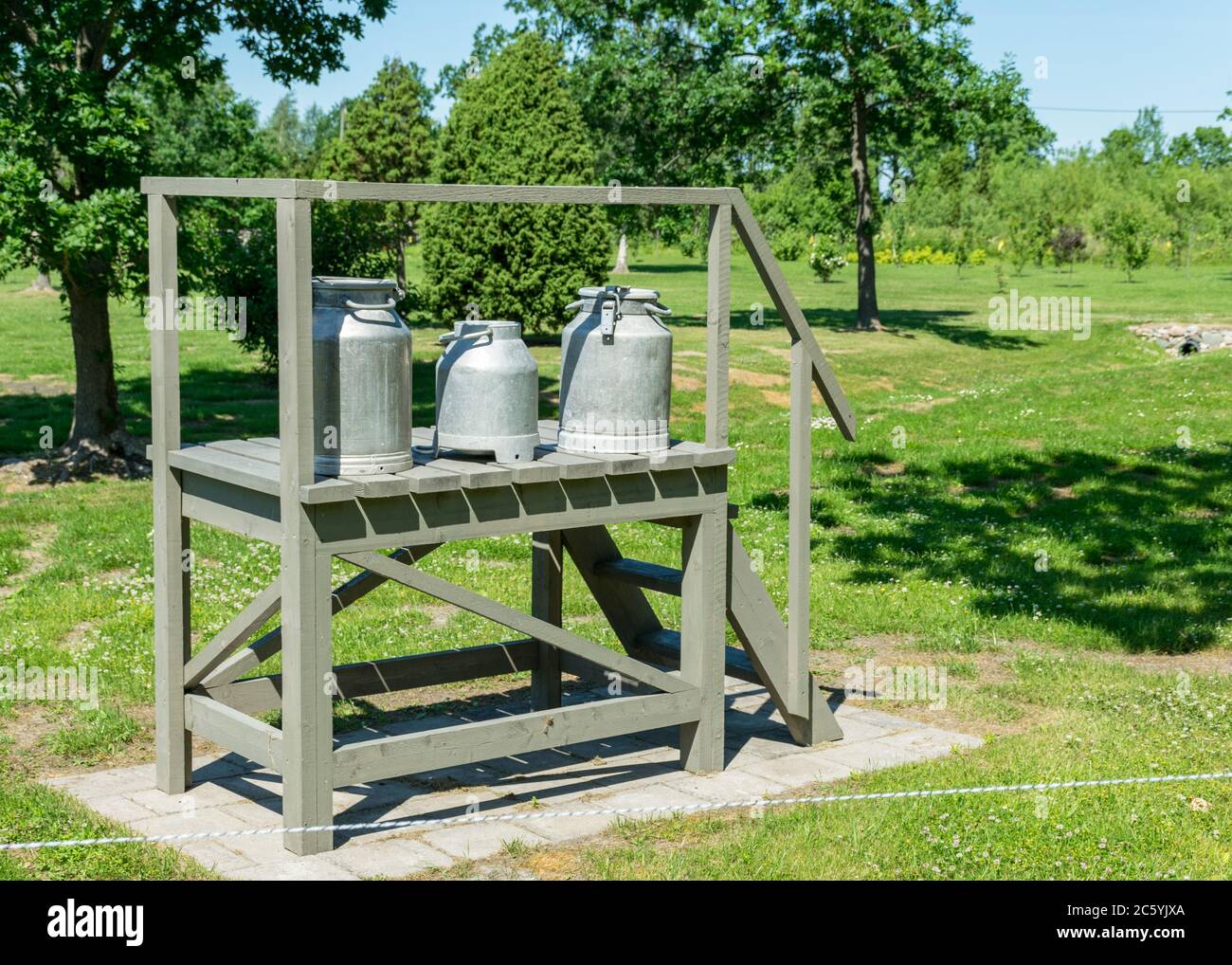 beautiful summer landscape with a wooden wooden structure and a milk ...