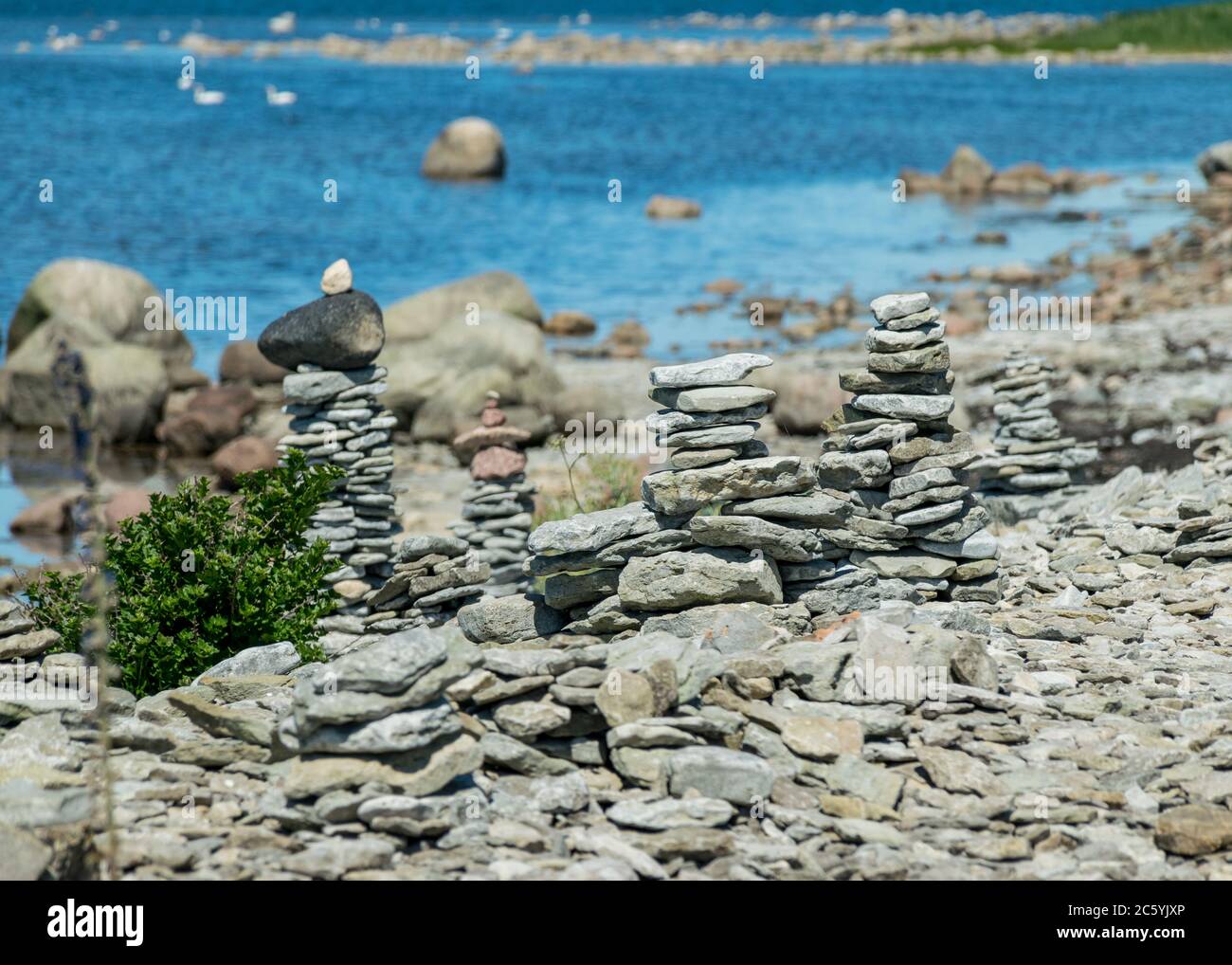 picture with beautiful white stone piles by the sea, these objects were ...