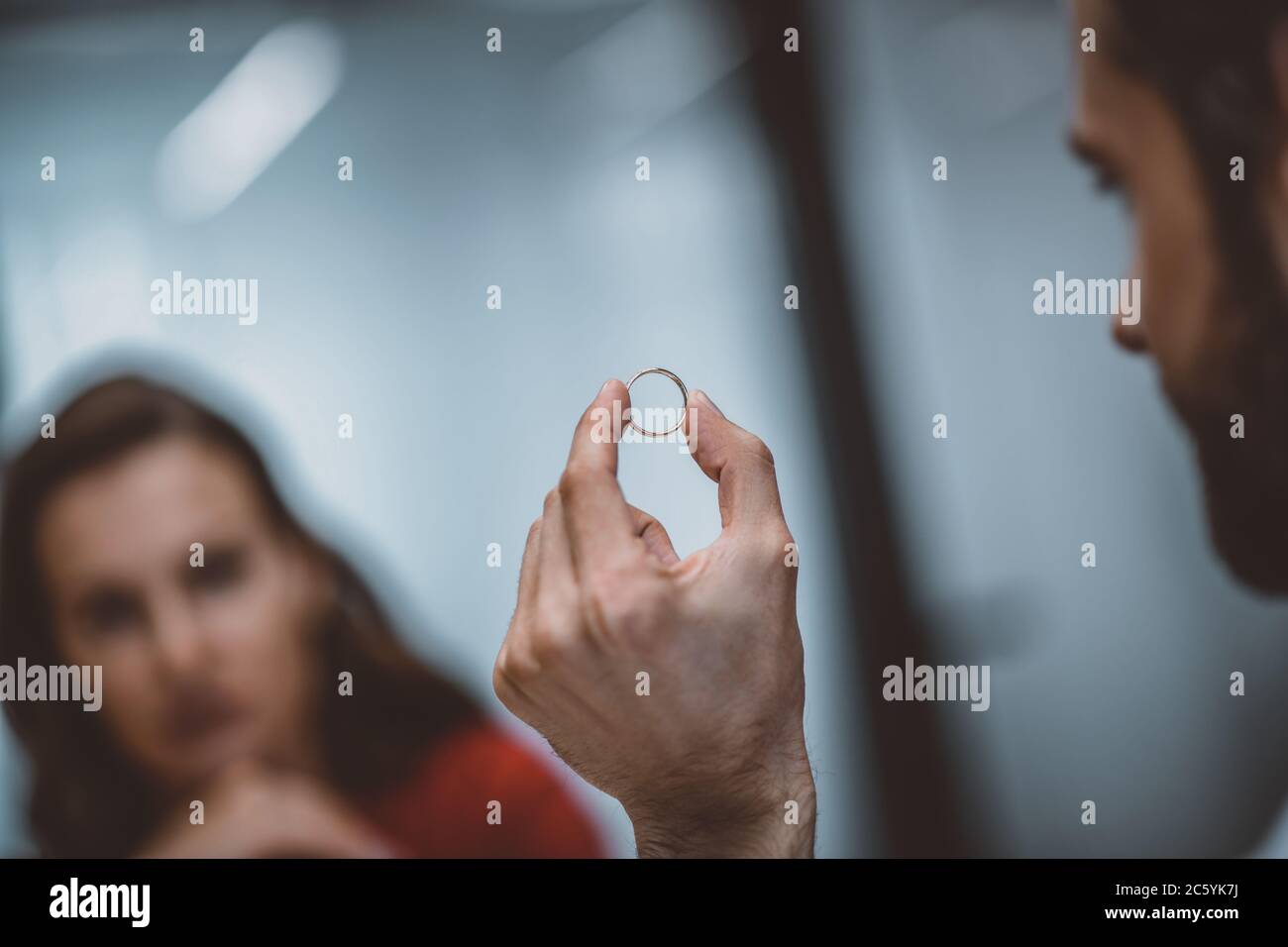 Man taking off his wedding ring from his hand Stock Photo - Alamy