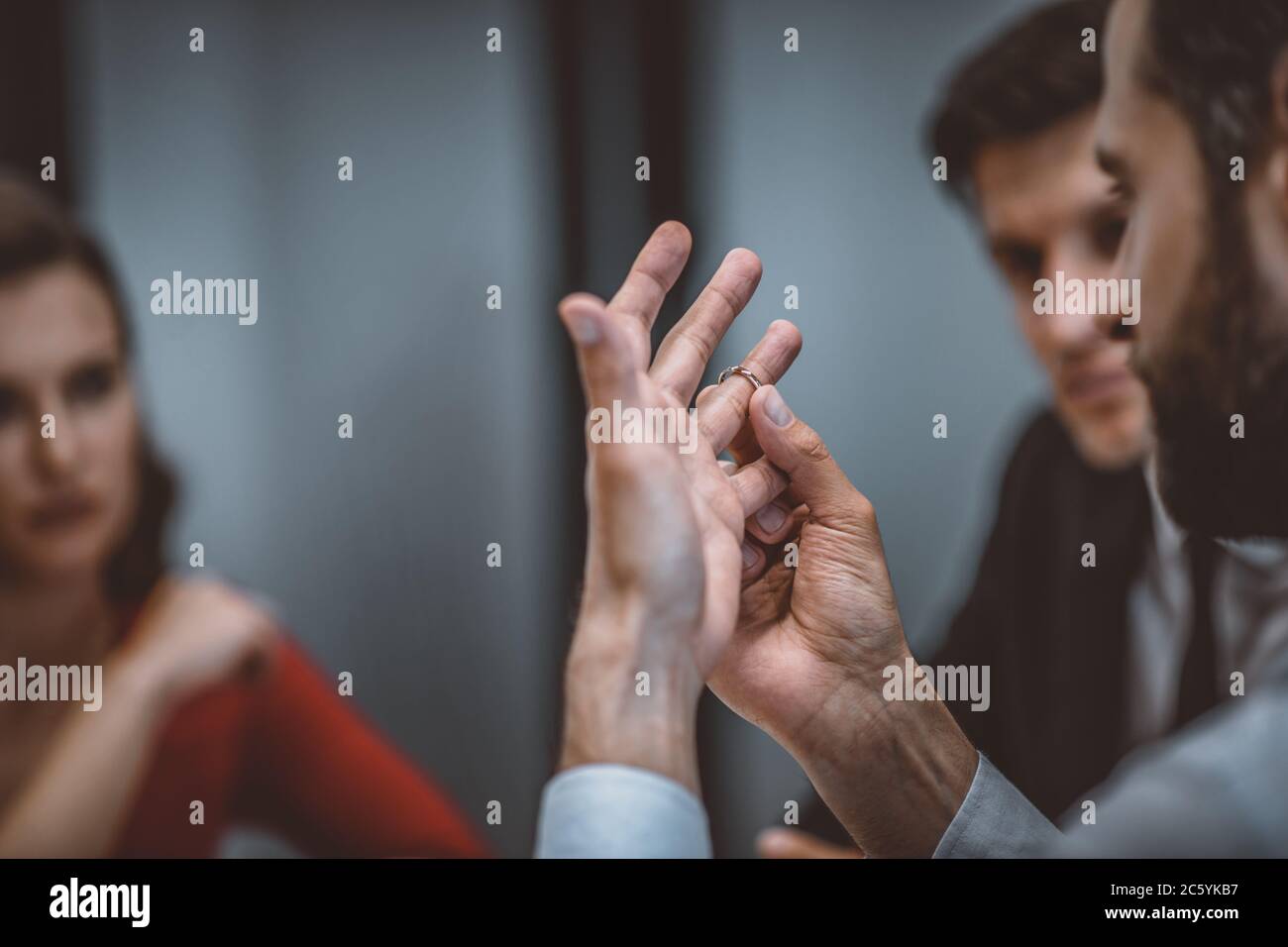 Man getting rid of his wedding ring Stock Photo - Alamy