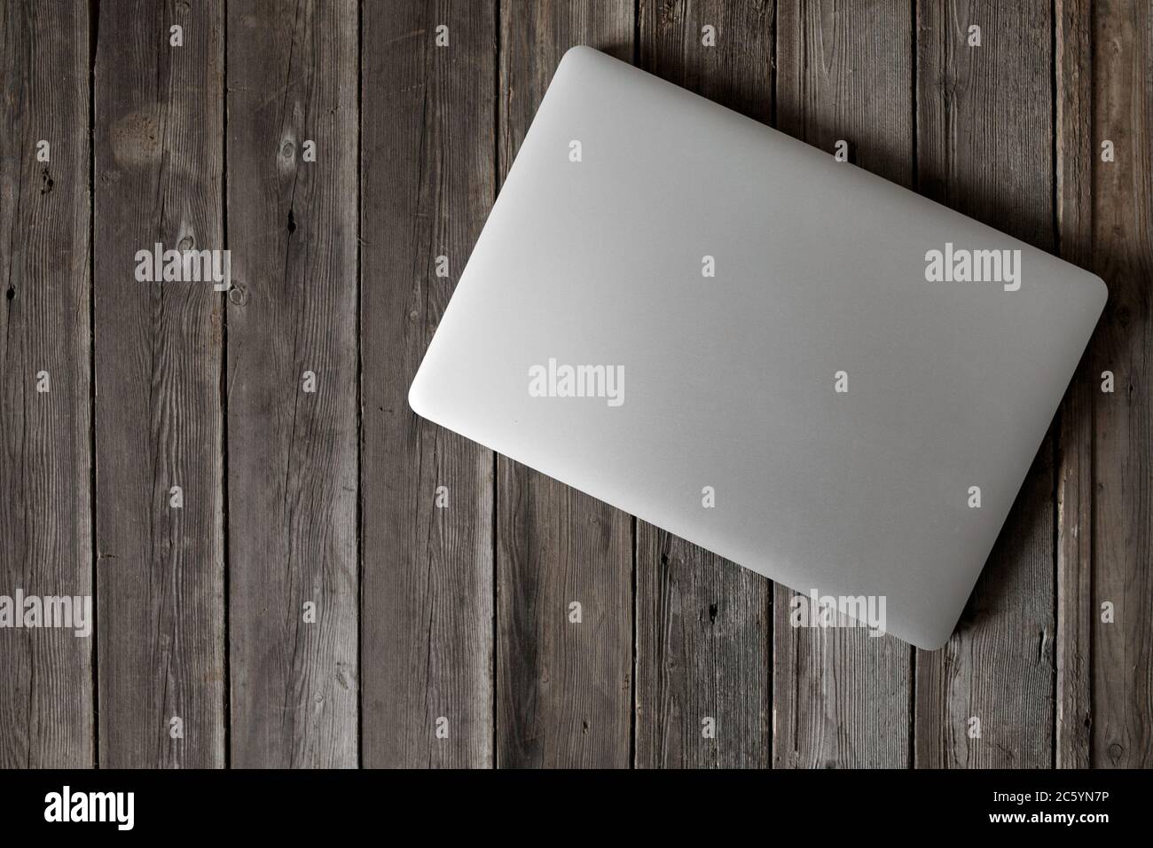 Mock up of blank laptop on the desk. Personal laptop computer on wood ...