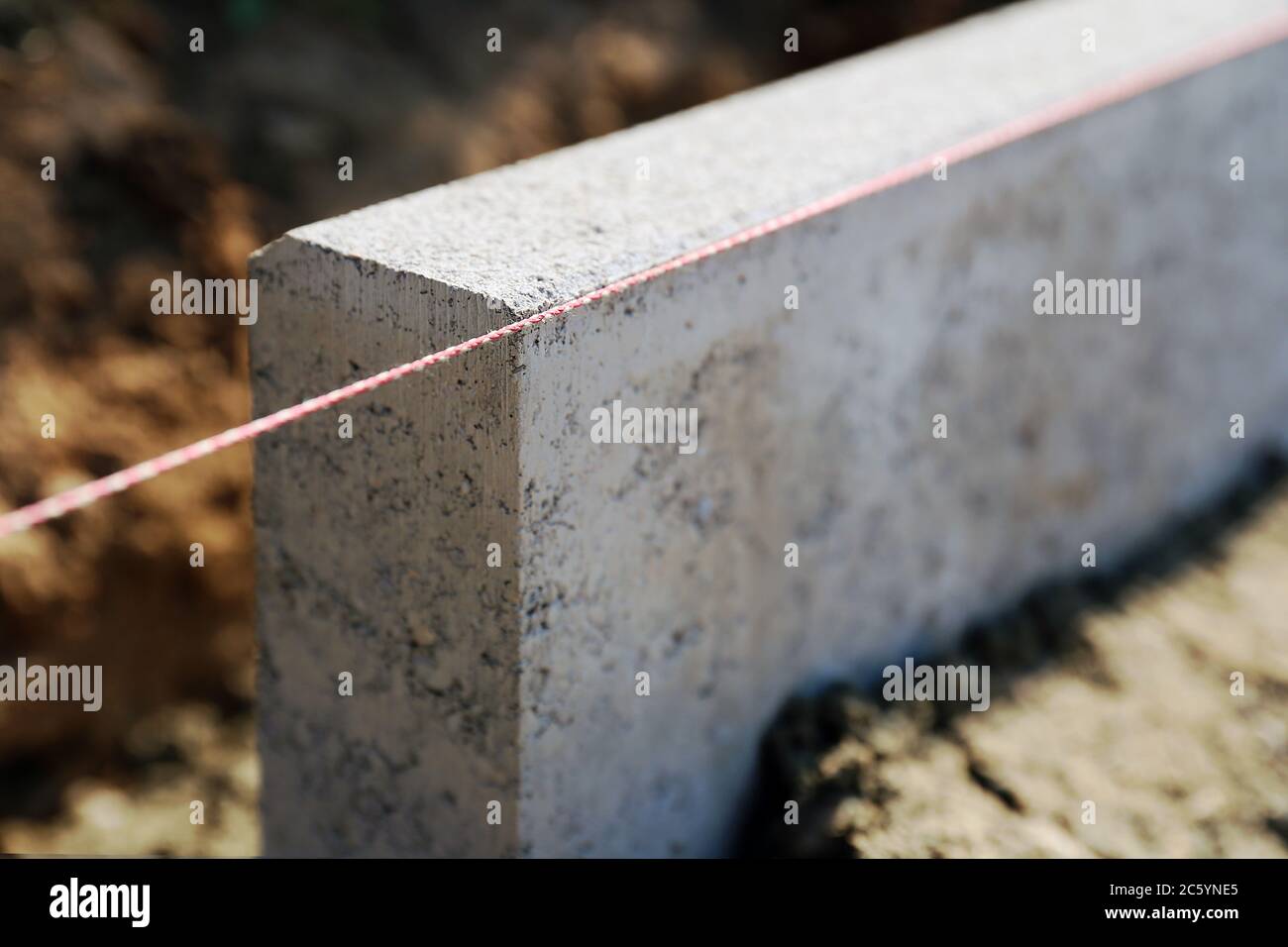 Putting a curb, construction site Stock Photo - Alamy