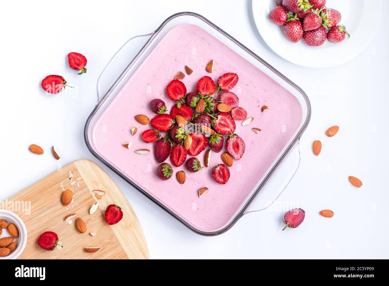 Top view of delicious creamy berry souffle cake in a glass dish with ...