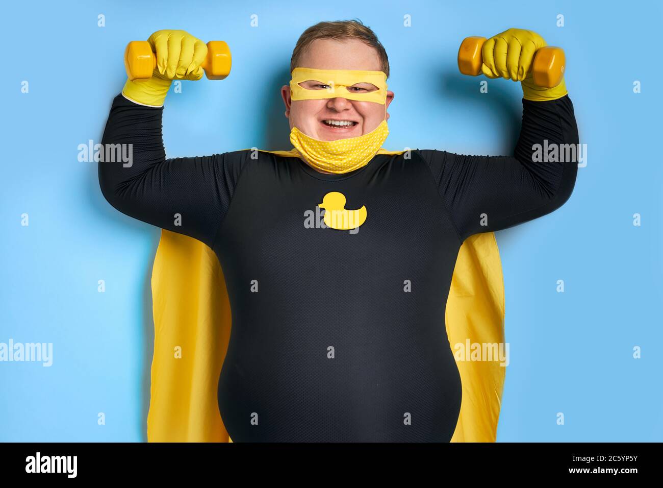 strong fat caucasian superhero man shows his muscles at camera, young ...