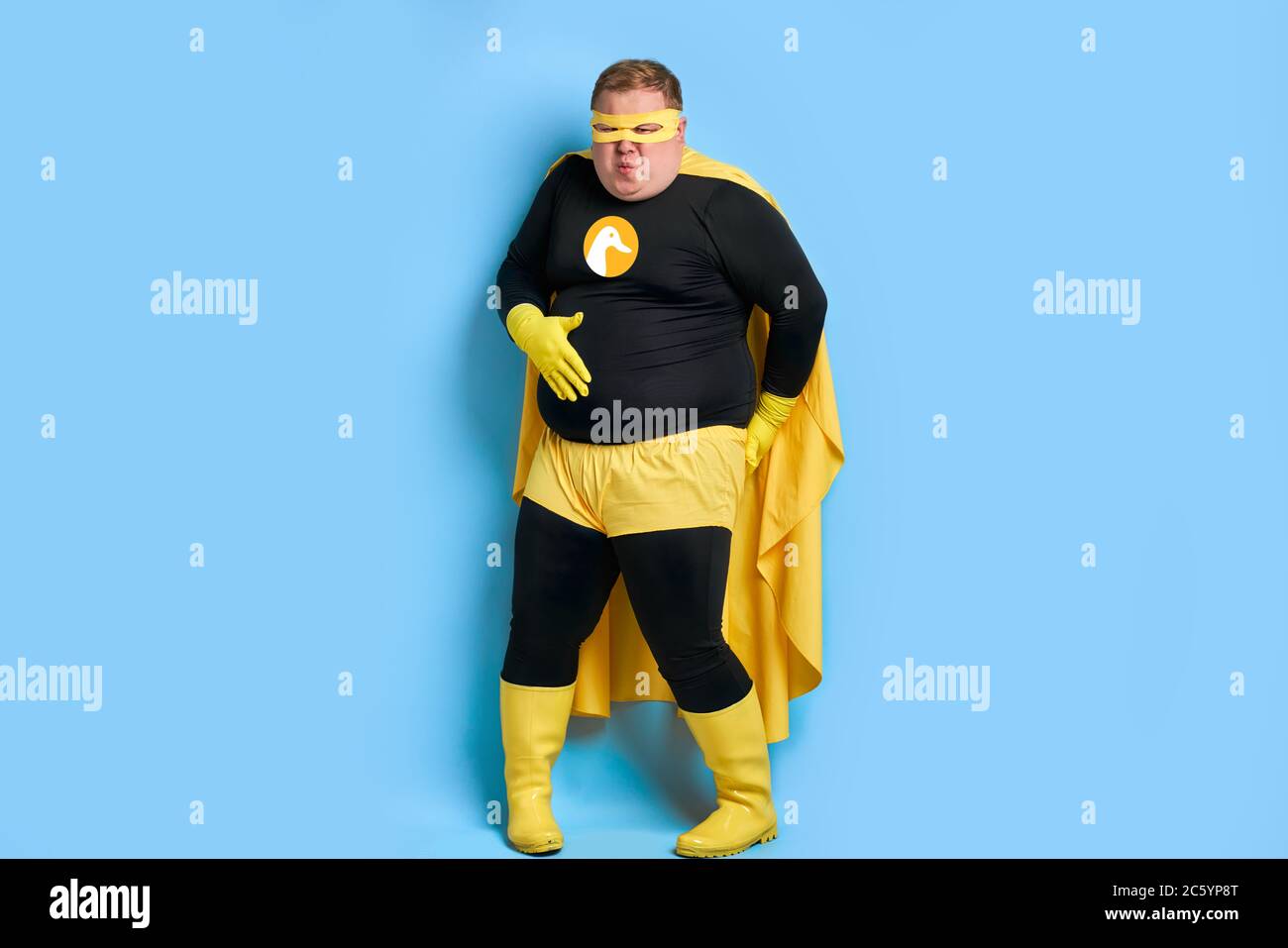 comical caucasian fat superhero man has stomach ache, young guy ...