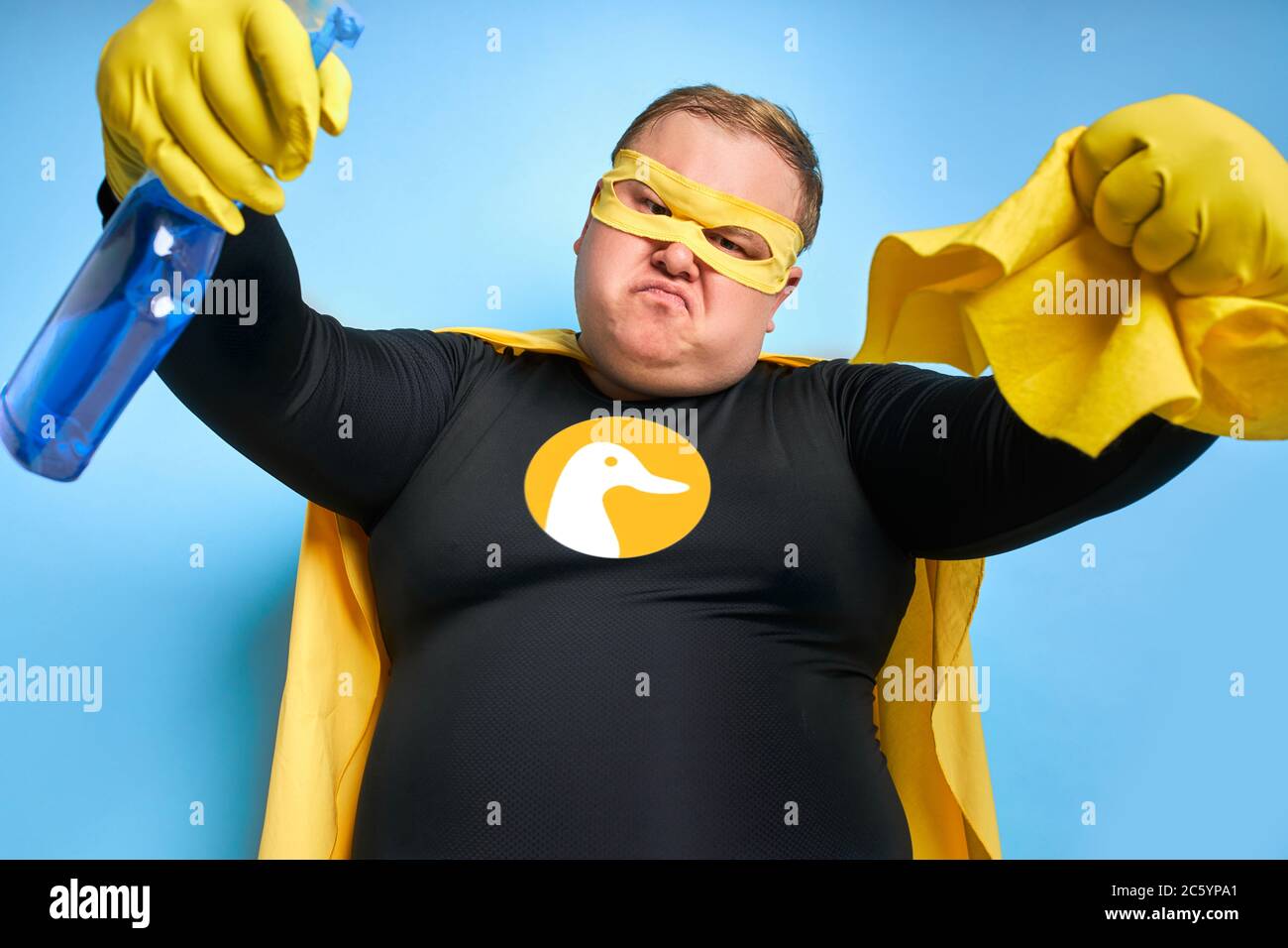 portrait of enthusiastic cleaning superhero isolated over blue ...