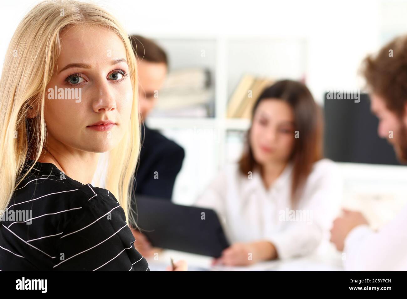Beautiful smiling cheerful girl at workplace look in camera Stock Photo ...