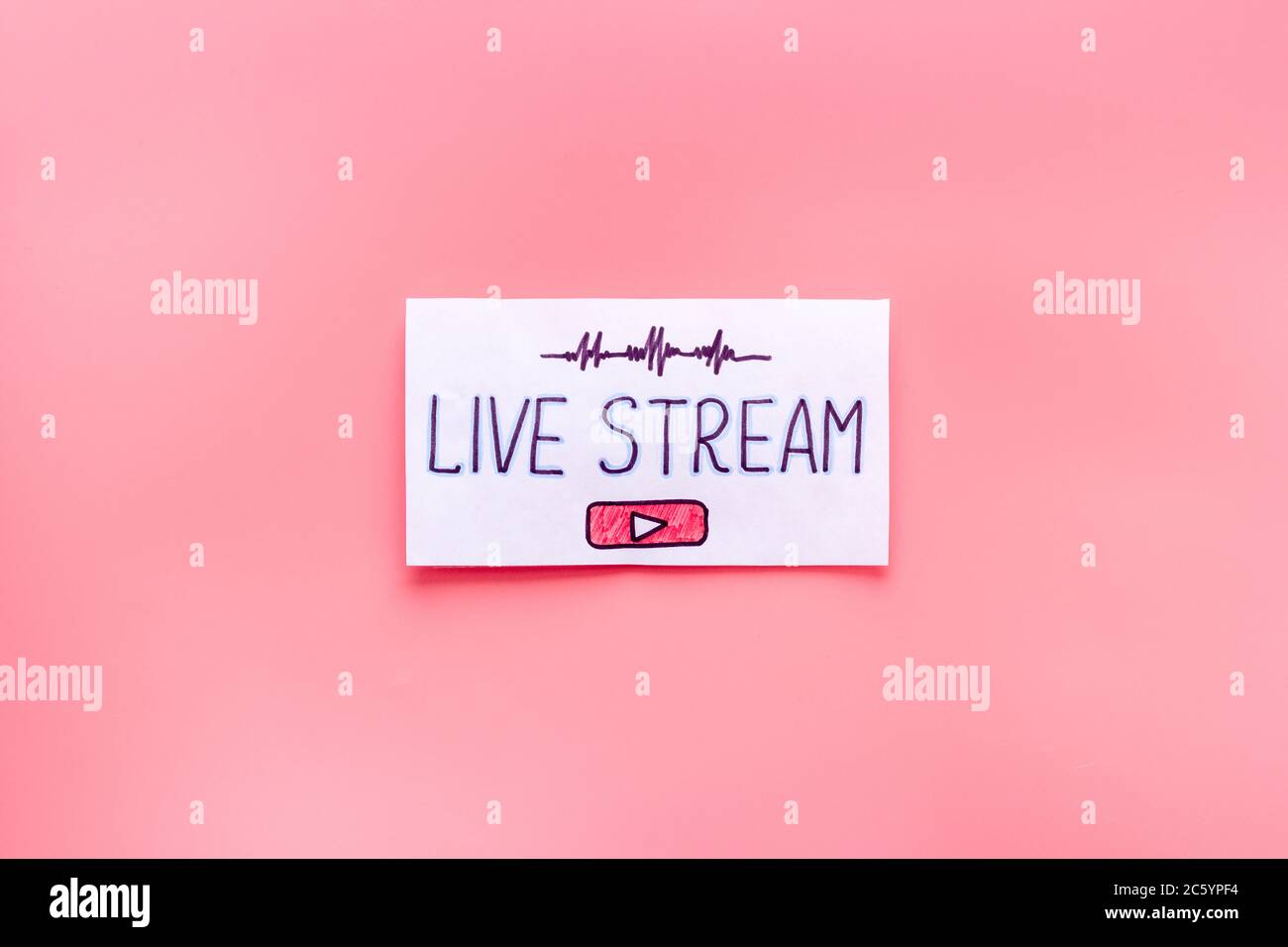 Live streaming concept - words on paper tablet on pink top view Stock ...