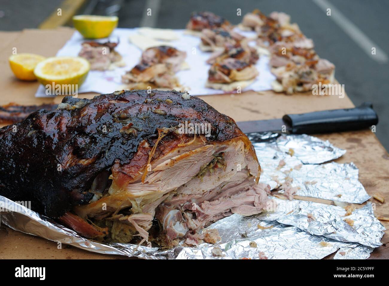 Street food, baked ham given with the lemon juice in Santiago ...