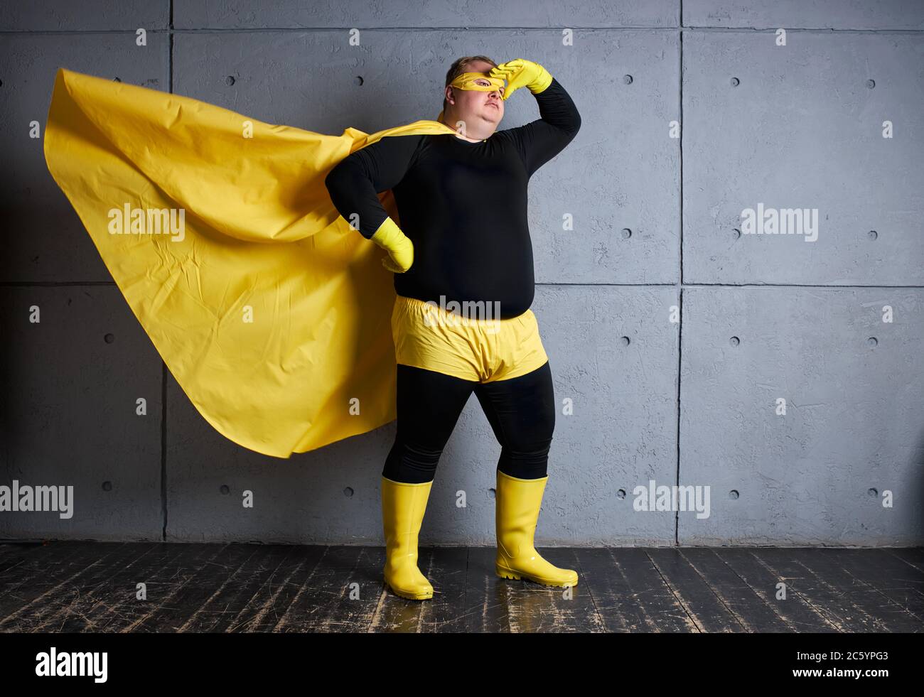 superhero fat man loking for danger and problems that he can solve ...