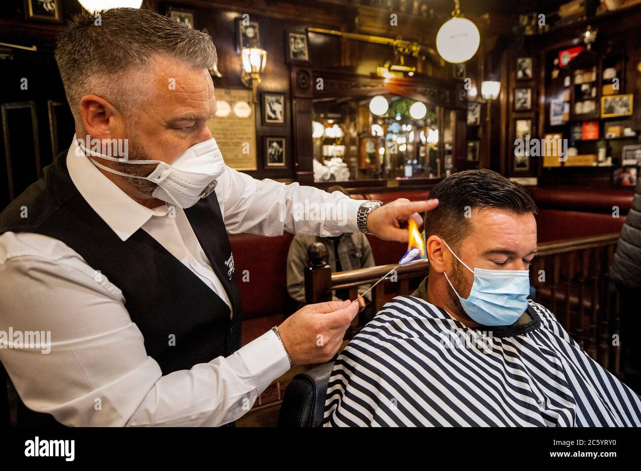 Singeing hair hi-res stock photography and images - Alamy